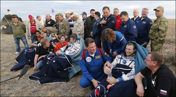 Russian cosmonaut back after record 879 days in space