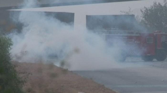 Police push Khattak-led PTI caravan back to Swabi Interchange