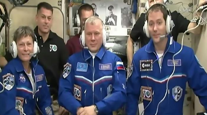 Russian spaceship delivers three astronauts to space station