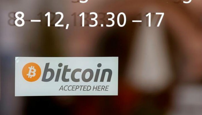 Bitcoin's total value hits record high above $14 billion