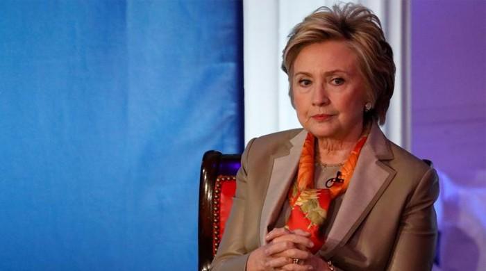 Clinton says false stories on Facebook helped Trump win election