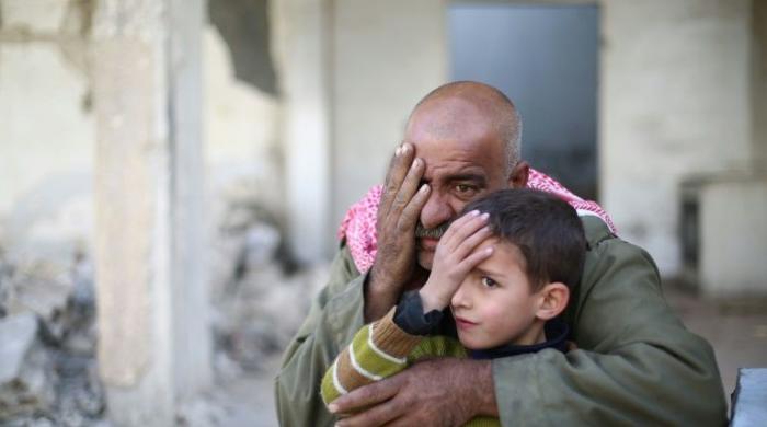 Syrian baby's photo inspires people around the world to cover one eye