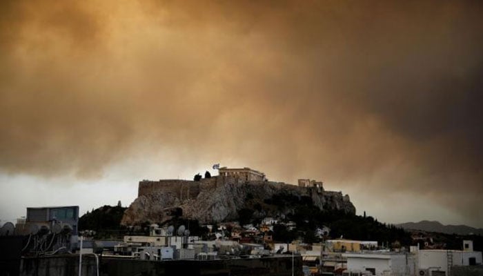 Greek wildfire kills at least 24 near Athens, residents flee homes