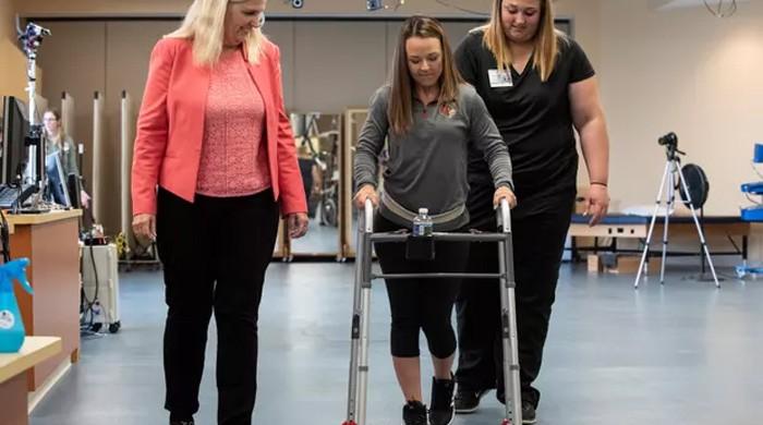 Four paralyzed people walk, stand or sit with new treatment