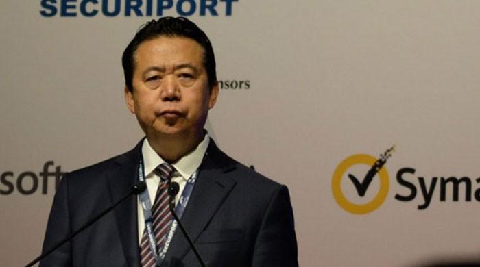 China says Interpol chief being probed 'on suspicion of violating the law'