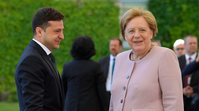 Germany's Merkel says she's 'fine' after trembling spell