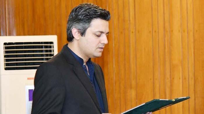 Hammad Azhar takes oath as federal minister