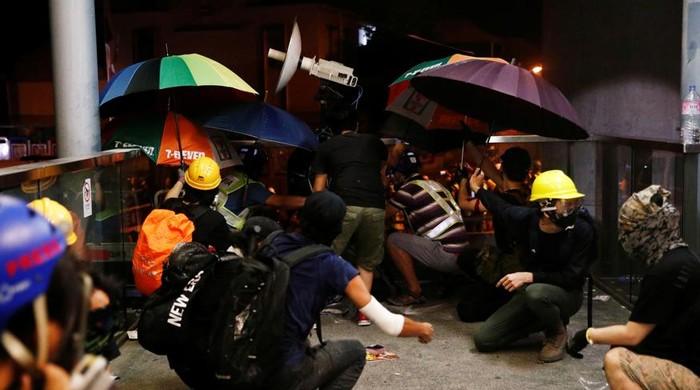 Police fire tear gas, rubber bullets in Hong Kong clash over anti-triad ...