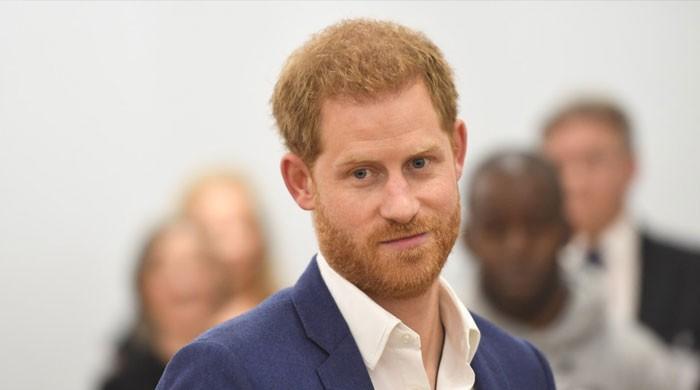 Prince Harry shows off wedding ring after being called 'handsome'
