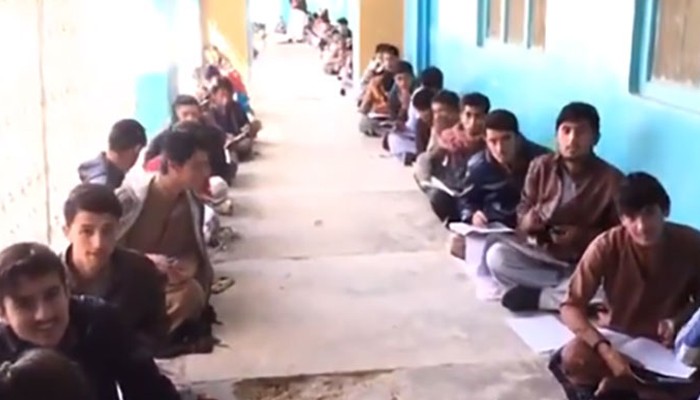 Students of a Quetta govt school give exams while sitting on the cold floor