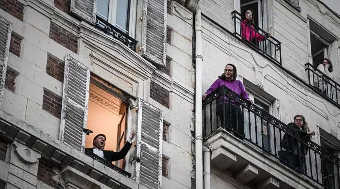 Balcony music stars bring joy to their daily audience in France amid ...