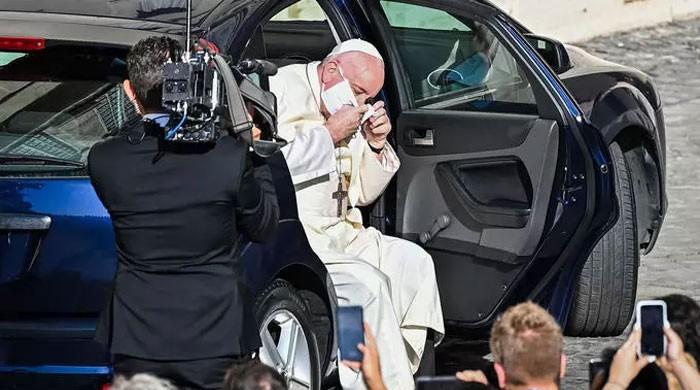 Pope Francis wears a face mask for the first time in public