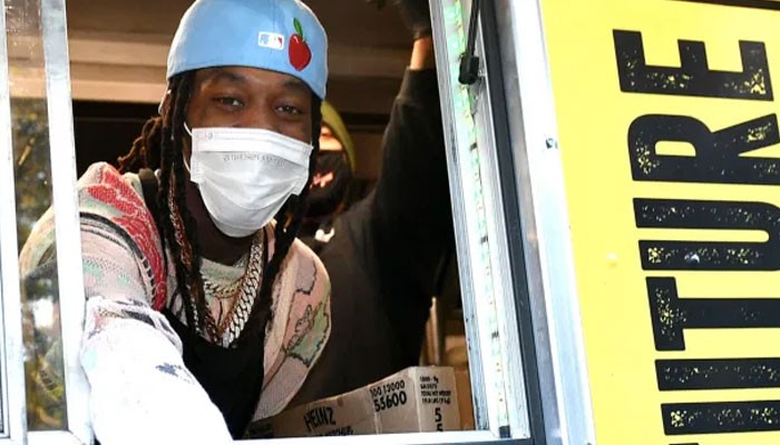 Offset hands out meals to voters waiting to cast their ballots in Atlanta