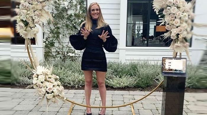 Adele celebrated New Year's with a beer and cigarette