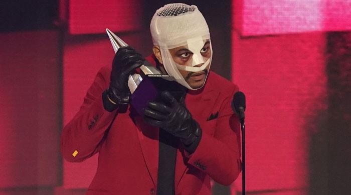 The Weekend finally addresses why she wore face bandages to promote his ...