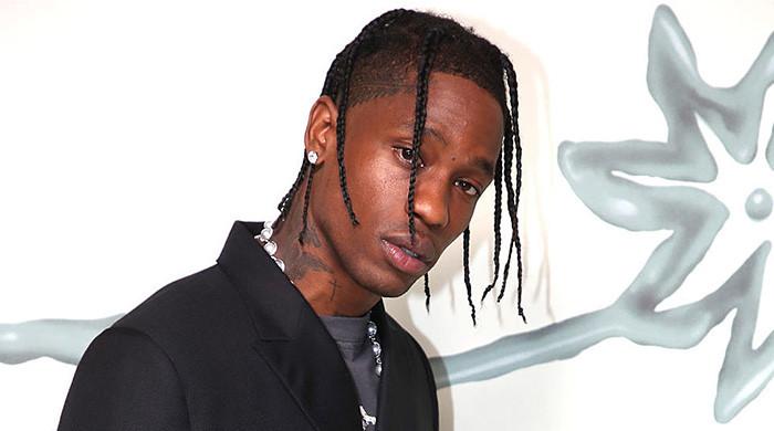 Travis Scott smiling from ear-to-ear after Kylie Jenner's pregnancy reveal