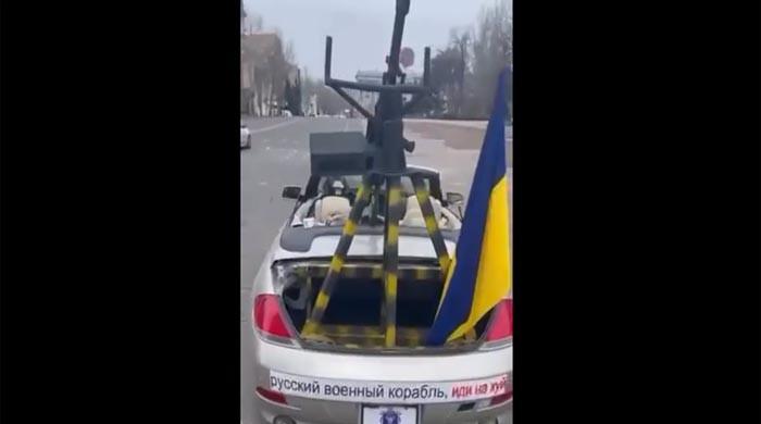 WATCH: Ukrainians fit heavy machine gun on BMW Convertible