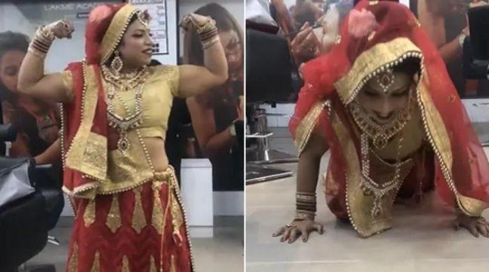 Watch: Bride sets new fitness goals, does push-ups in wedding dress