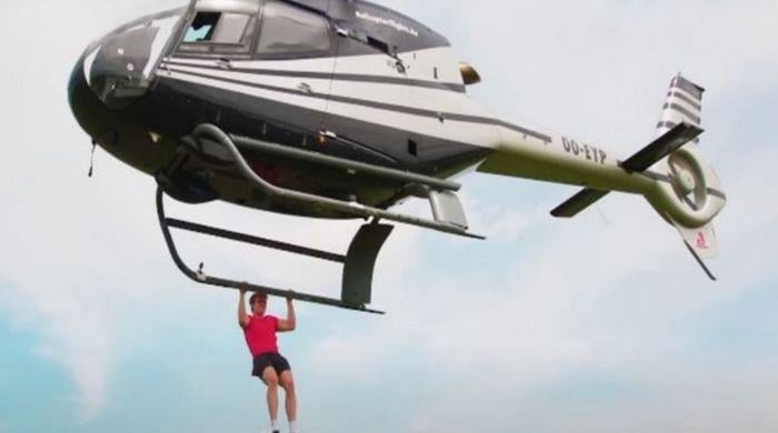 WATCH: Man breaks record for most pull-ups dangling from helicopter