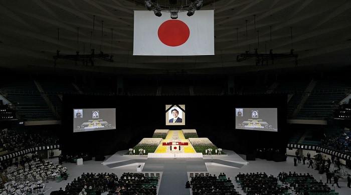 With flowers and a gun salute, Japan bids farewell to Abe at state funeral