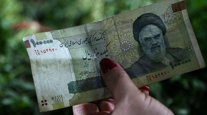 Iranian currency slides to new low amid unrest, isolation