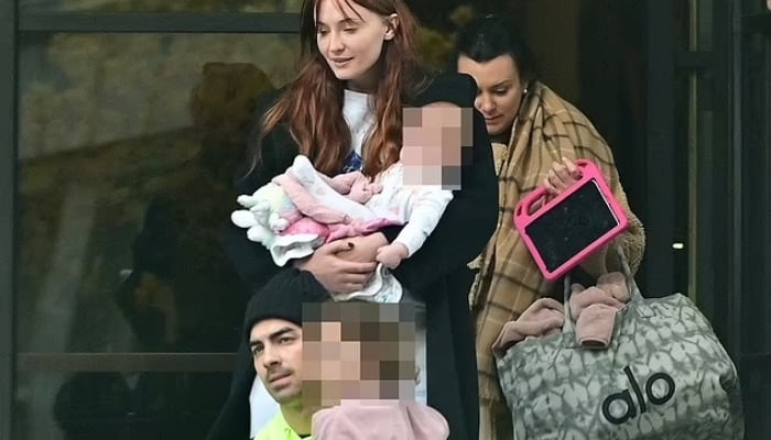 Sophie Turner walks out of hotel in style with Joe Jonas and their two young daughters