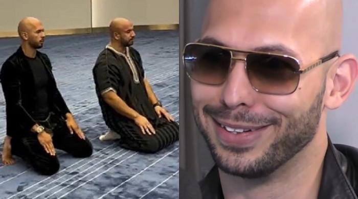 Andrew Tate spotted walking with Holy Quran in his hands