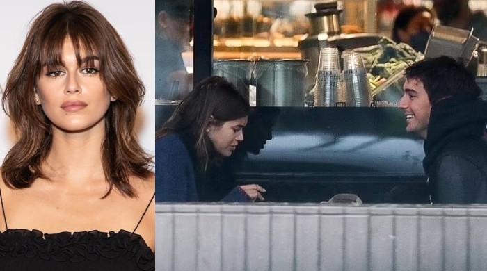 Kaia Gerber seen at lunch with a male friend in rain while beau Austin ...