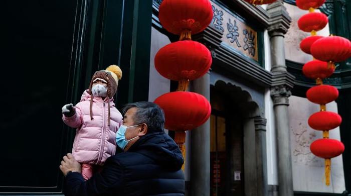China’s population falls for first time since 1961, highlights ...