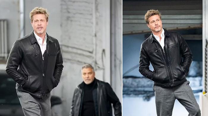 Brad Pitt looks dapper in black leather jacket as he joins George ...