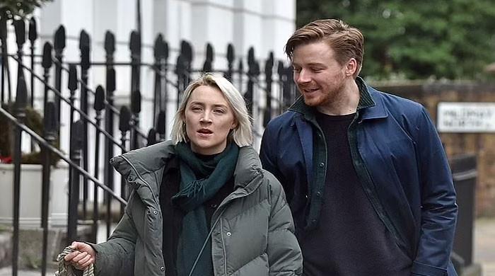 Jack Lowden and girlfriend Saoirse Ronan look loved-up as they head out ...