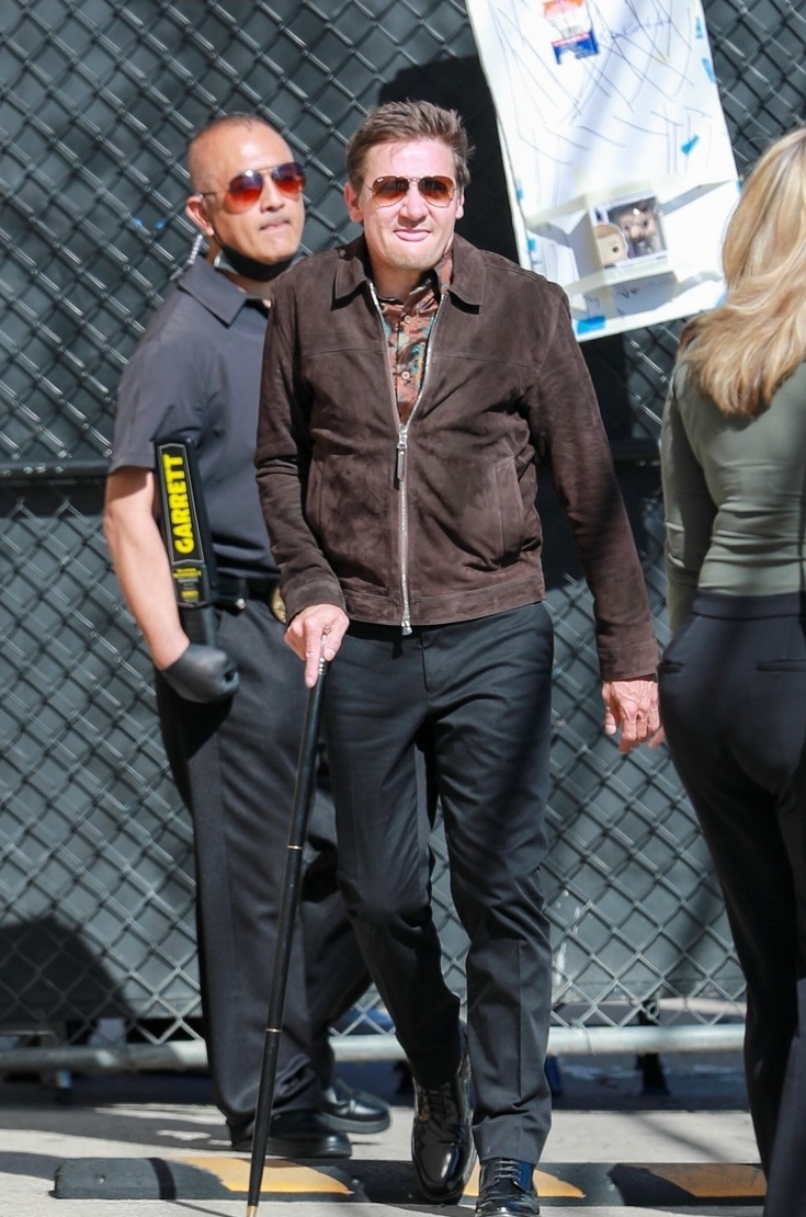 Jeremy Renner uses walking stick as he walks into Jimmy Kimmel Live studio