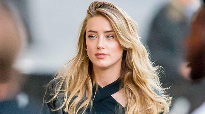 Amber Heard evades question on Johnny Depp trial with smile