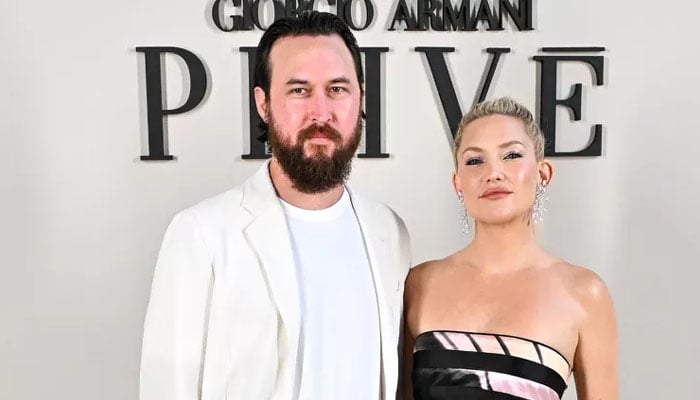 Kate Hudson poses with fiancé Danny Fujikawa at Giorgio Armani Show