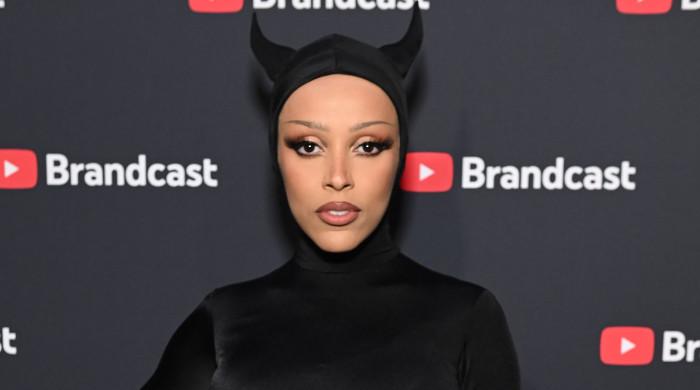 Doja Cat's hair game gets even bolder with a pink buzz cut and spider ...