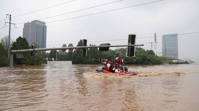 China flood death toll rises to 30 as relentless rains batter Beijing