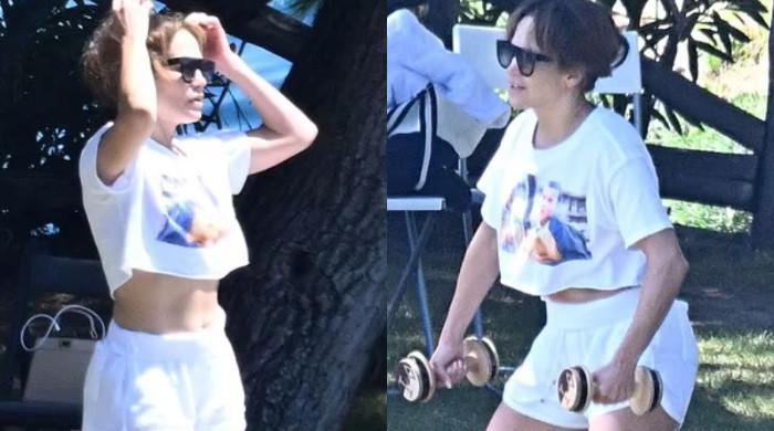 Jennifer Lopez shows off her toned abs as she works out during Italy trip
