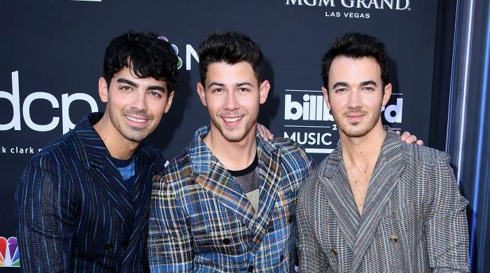 Jonas Brothers have heartfelt reunion on stage as Joe files for divorce ...