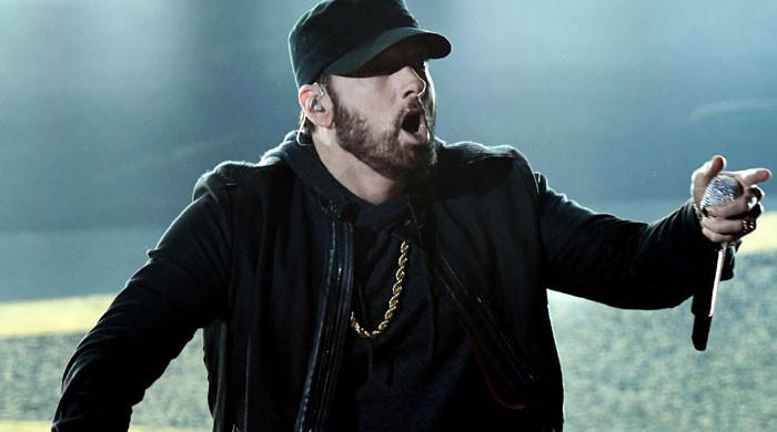Eminem gets behind mic to rap about addiction past