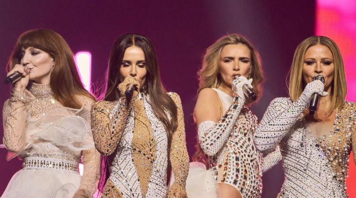 Girls Aloud concert halted as fan nearly pulls Cheryl off stage