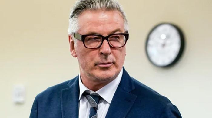 Alec Baldwin back at father duties after 'Rust' case reopens