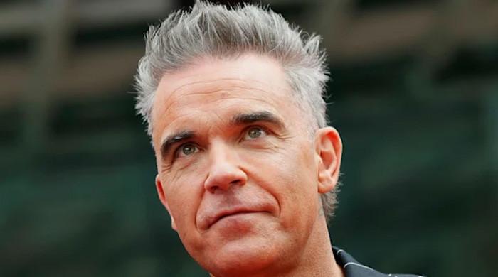 Robbie Williams on how Queen Elizabeth II's death cost millions