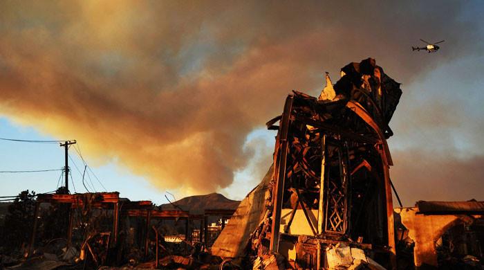 Big Los Angeles wildfire switches direction, posing new threat despite ...