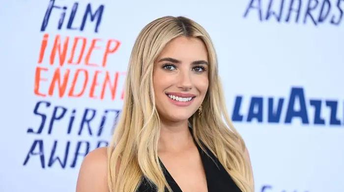 Emma Roberts debuts new 'sunrise red' look