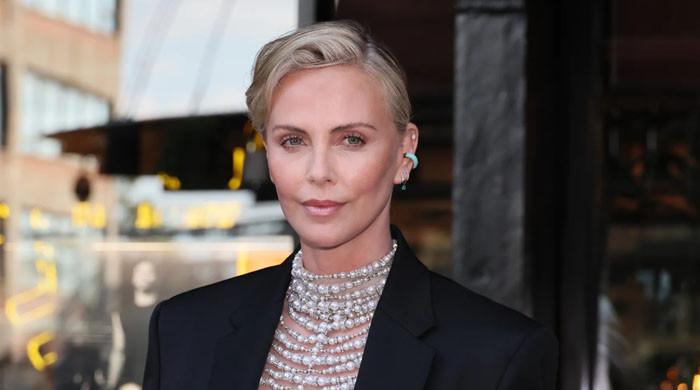 Single mom Charlize Theron says women think she 'can't keep a man'