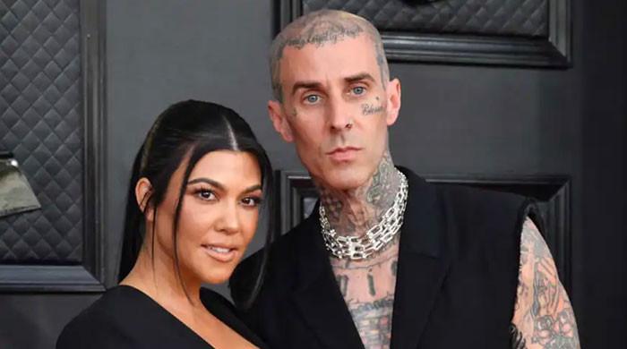 Kourtney Kardashian reacts to second baby rumours with Travis Barker